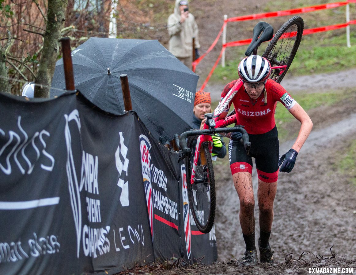 Cara O'Neill climbs a steep muddy hill in the rain. Collegiate Club ...