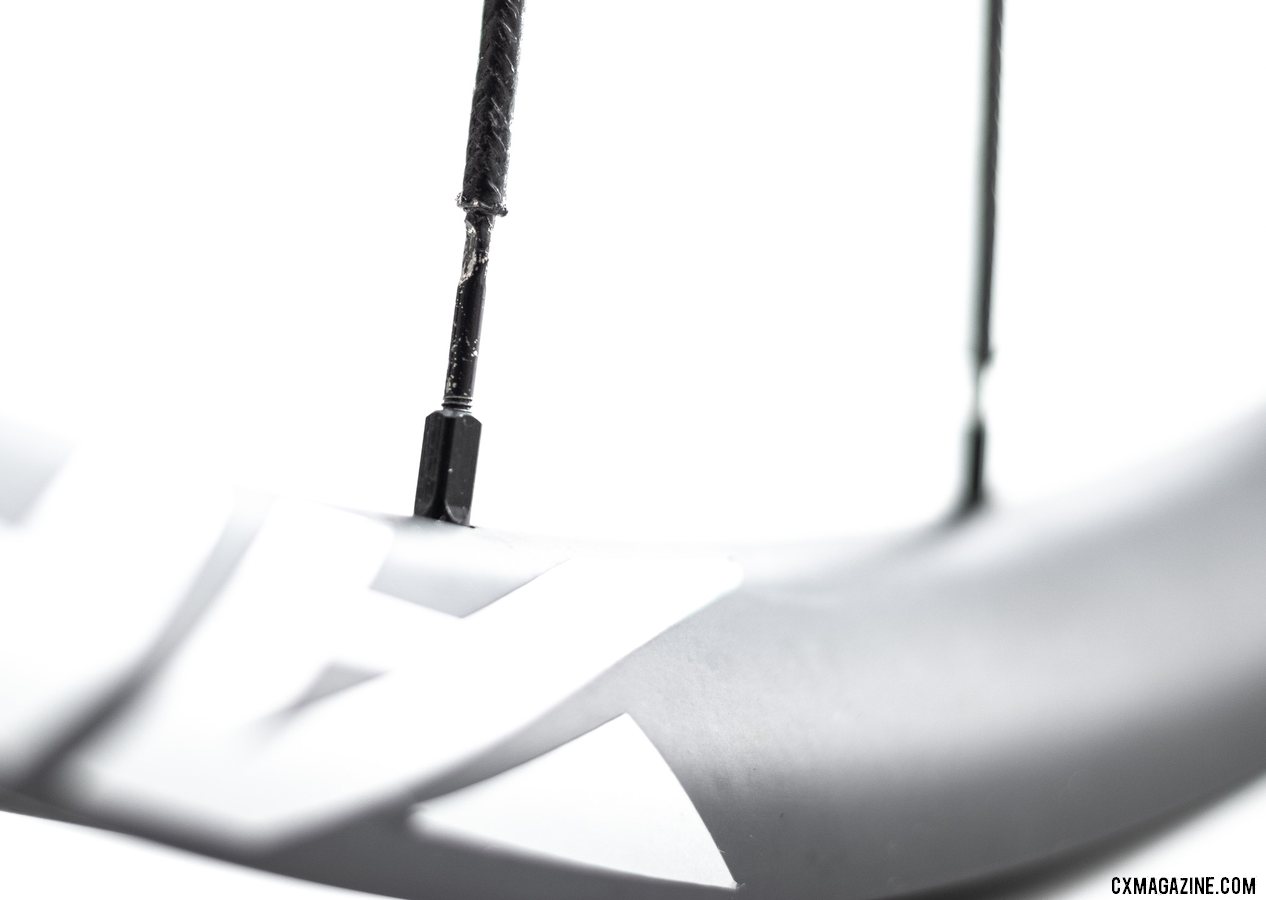 The 14g threaded spoke end has a wrench flat that is held to prevent ...